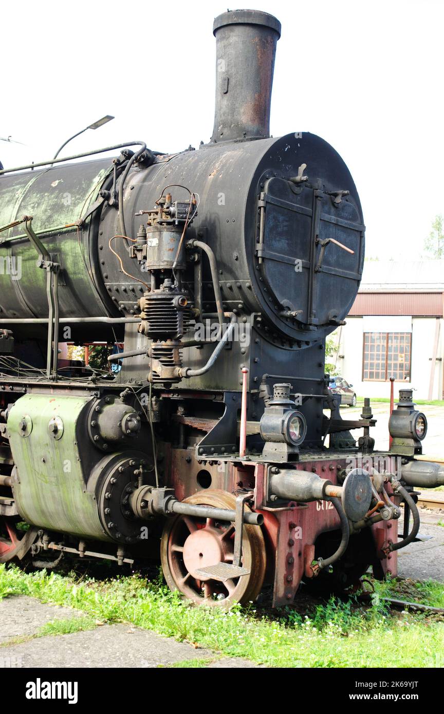 The front part of a steam locomotive. A fragment of the boiler, wheels ...