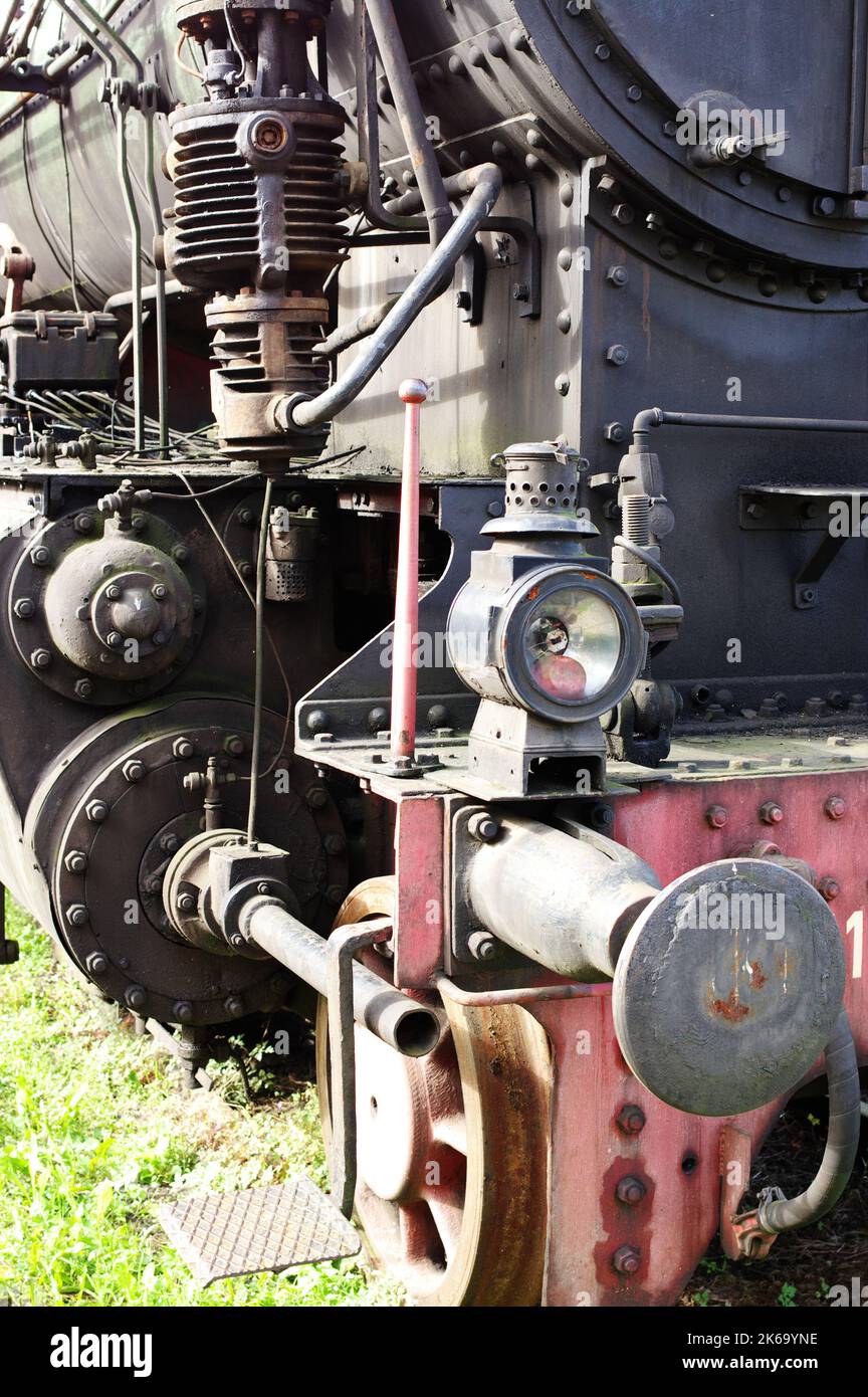 The front part of a steam locomotive. A fragment of the boiler, wheels ...