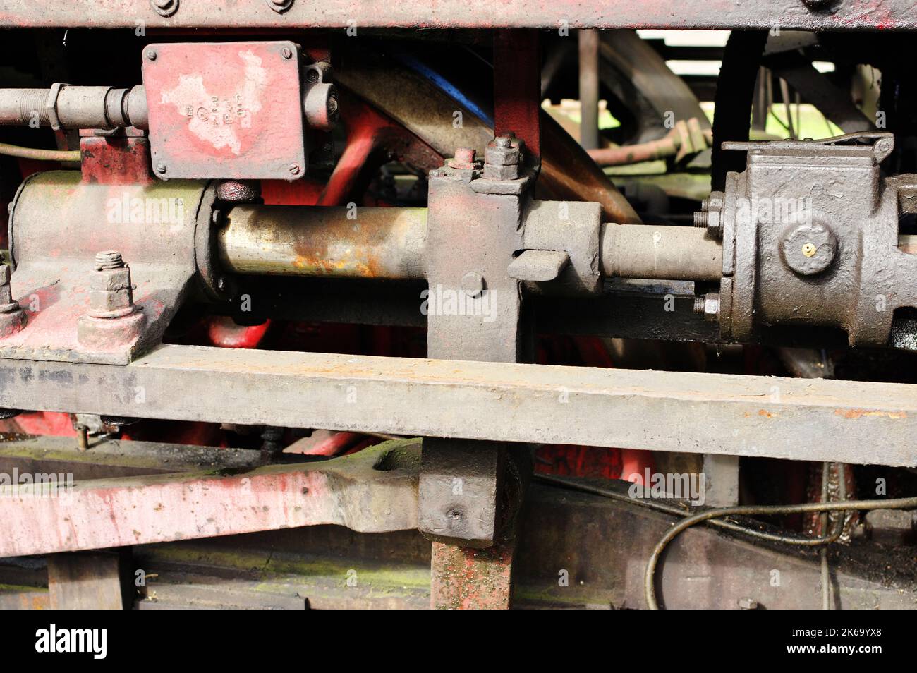 Old steam locomotive. A part of the suspension. Pistons are visible ...