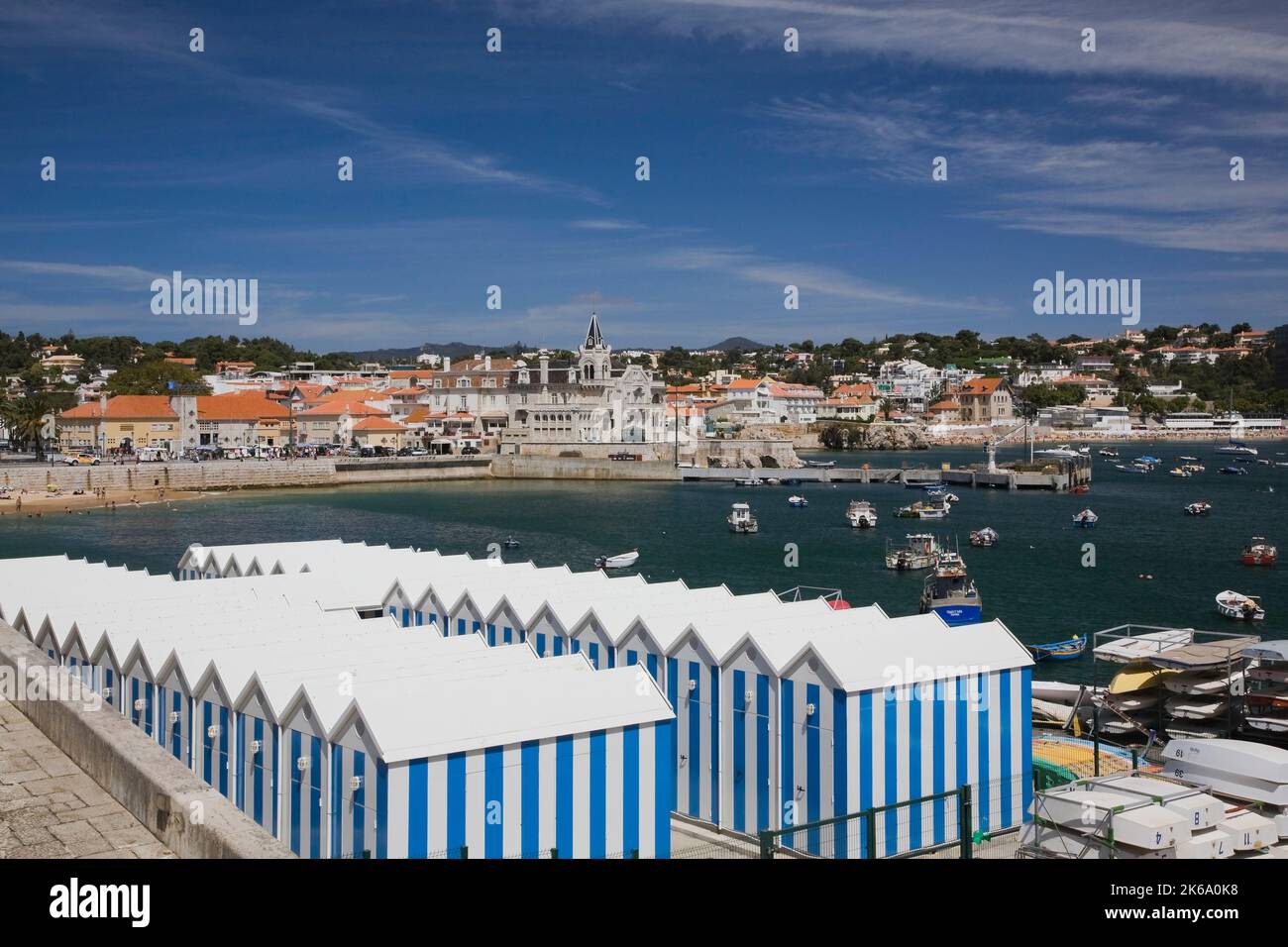 Storage sheds and moored fishing boats in harbour at Cascais, Portugal ...