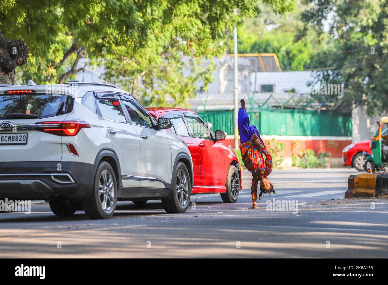 New Delhi, India. 1st Oct, 2022. A poor girl child performs acrobatics ...