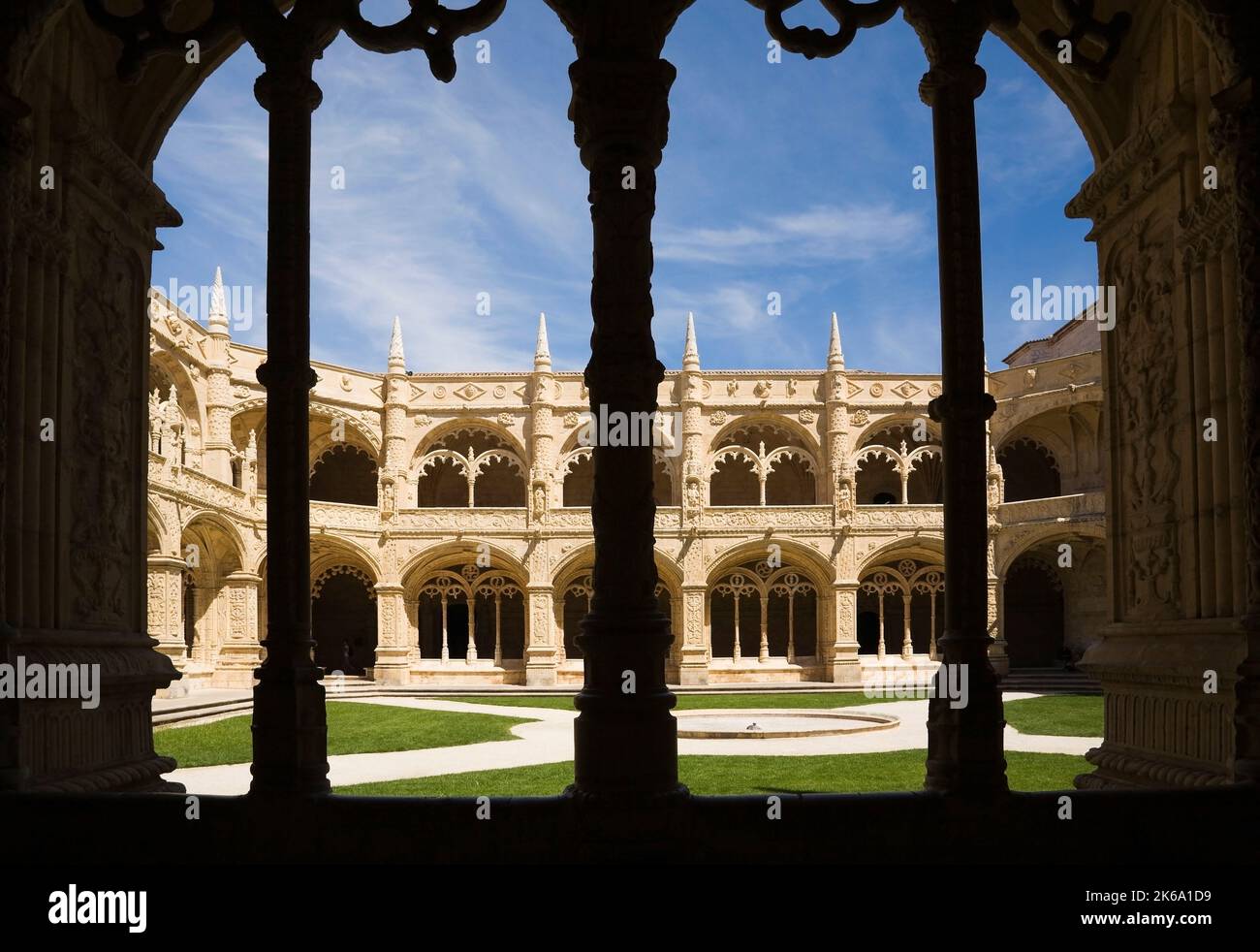 Inner courtyard through silhouetted columns at Jeronimos Monastery ...