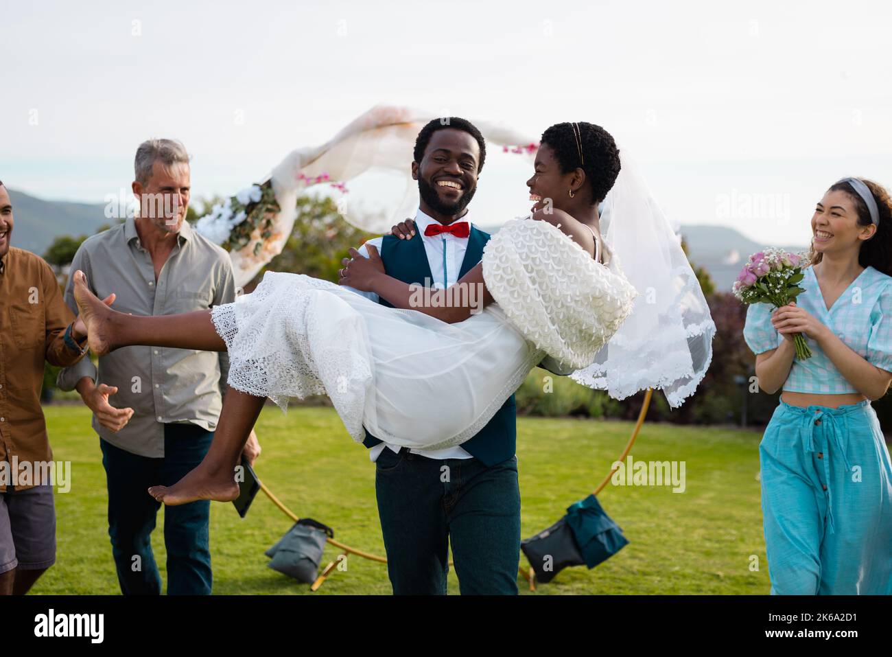 Portrait of happy african american couple carrying during wedding Stock ...