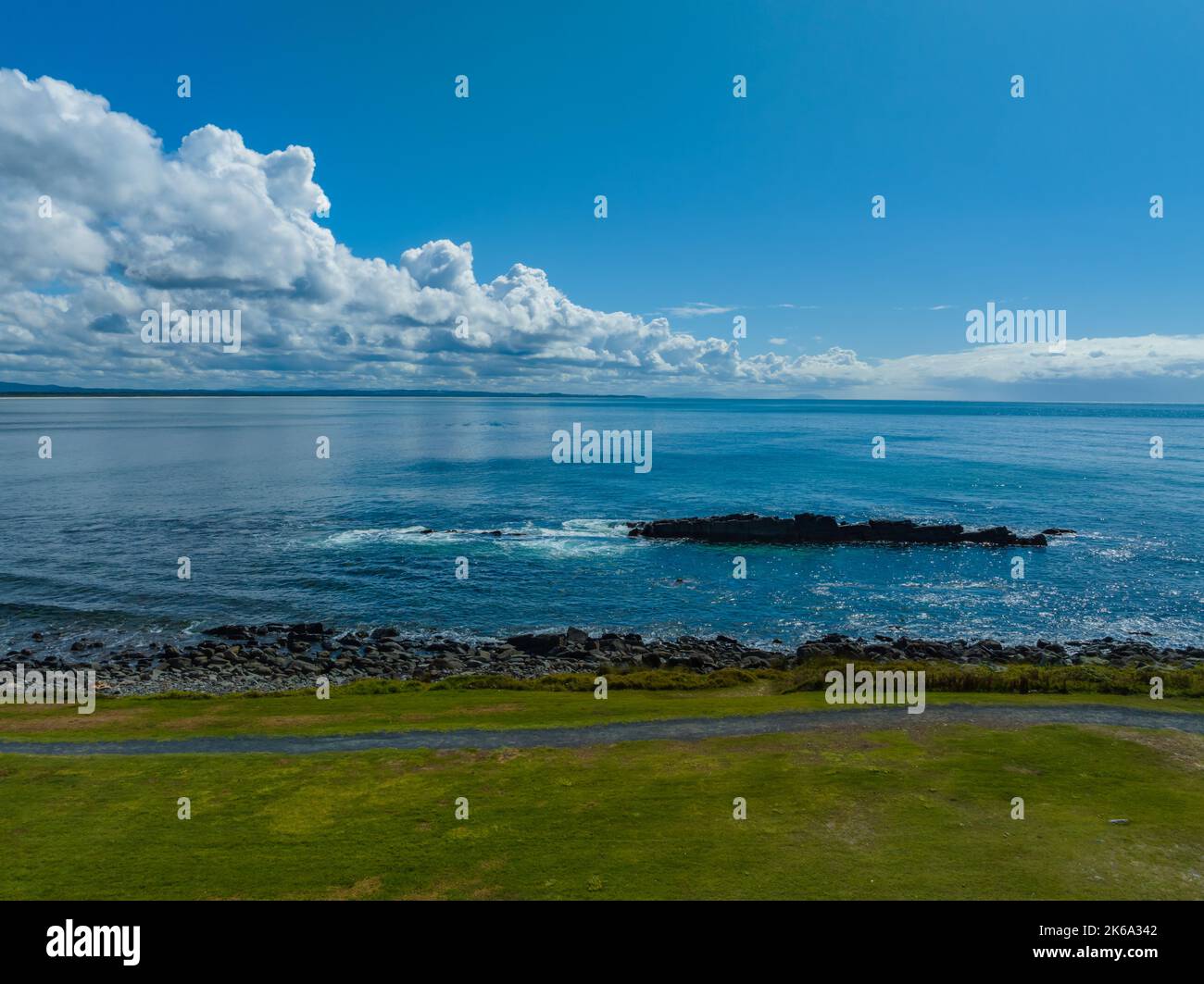 Daytime seascape with clouds at Pebbly Beach in Forster on the ...
