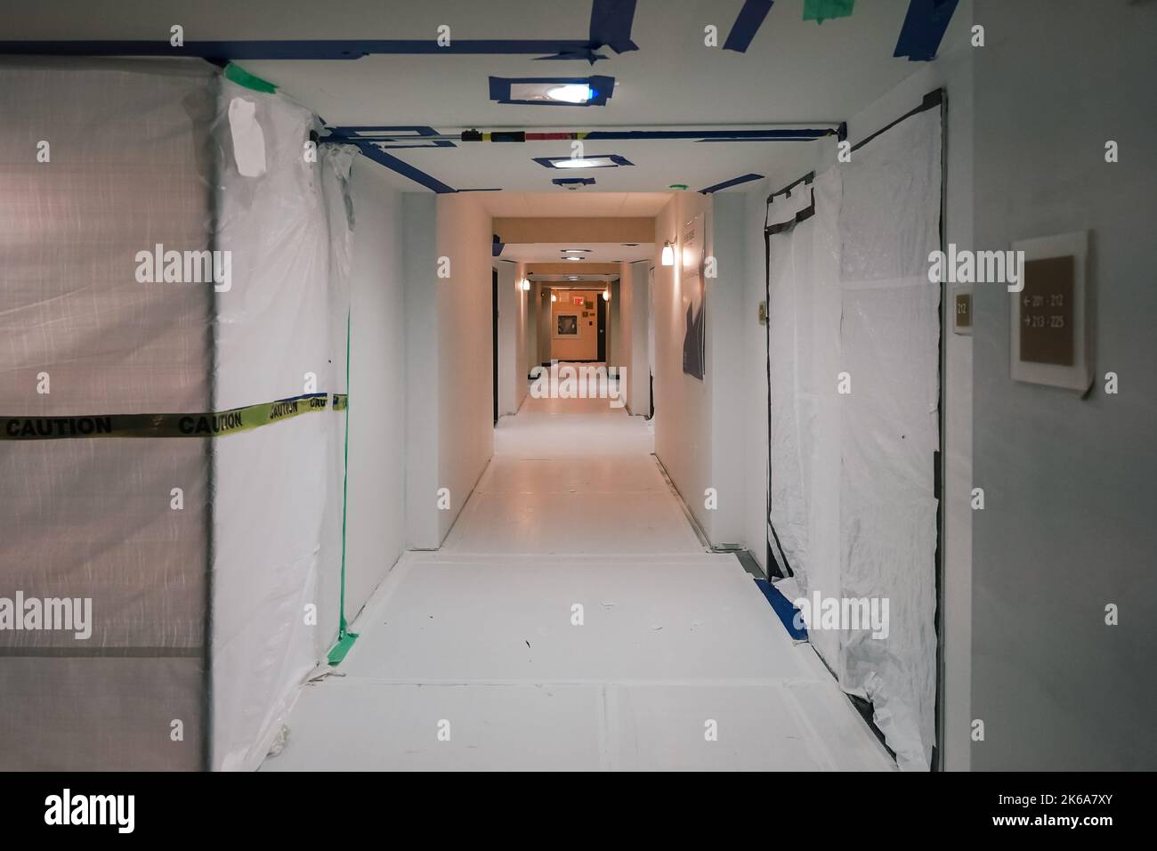 Inside of a building or hotel taped off for interior repair and ...
