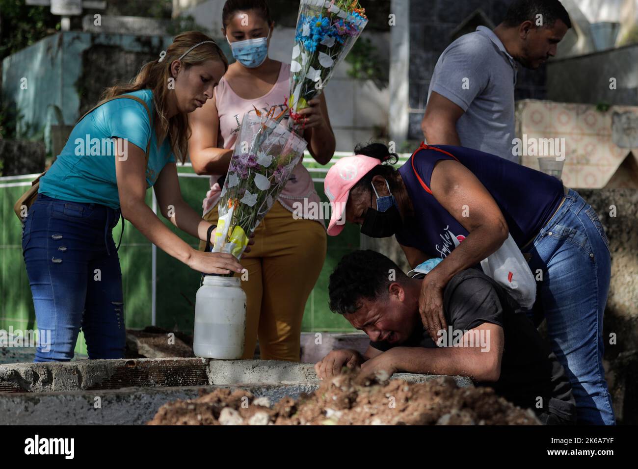 Las Tejerias, Venezuela. 12th Oct, 2022. Relatives of two victims of ...