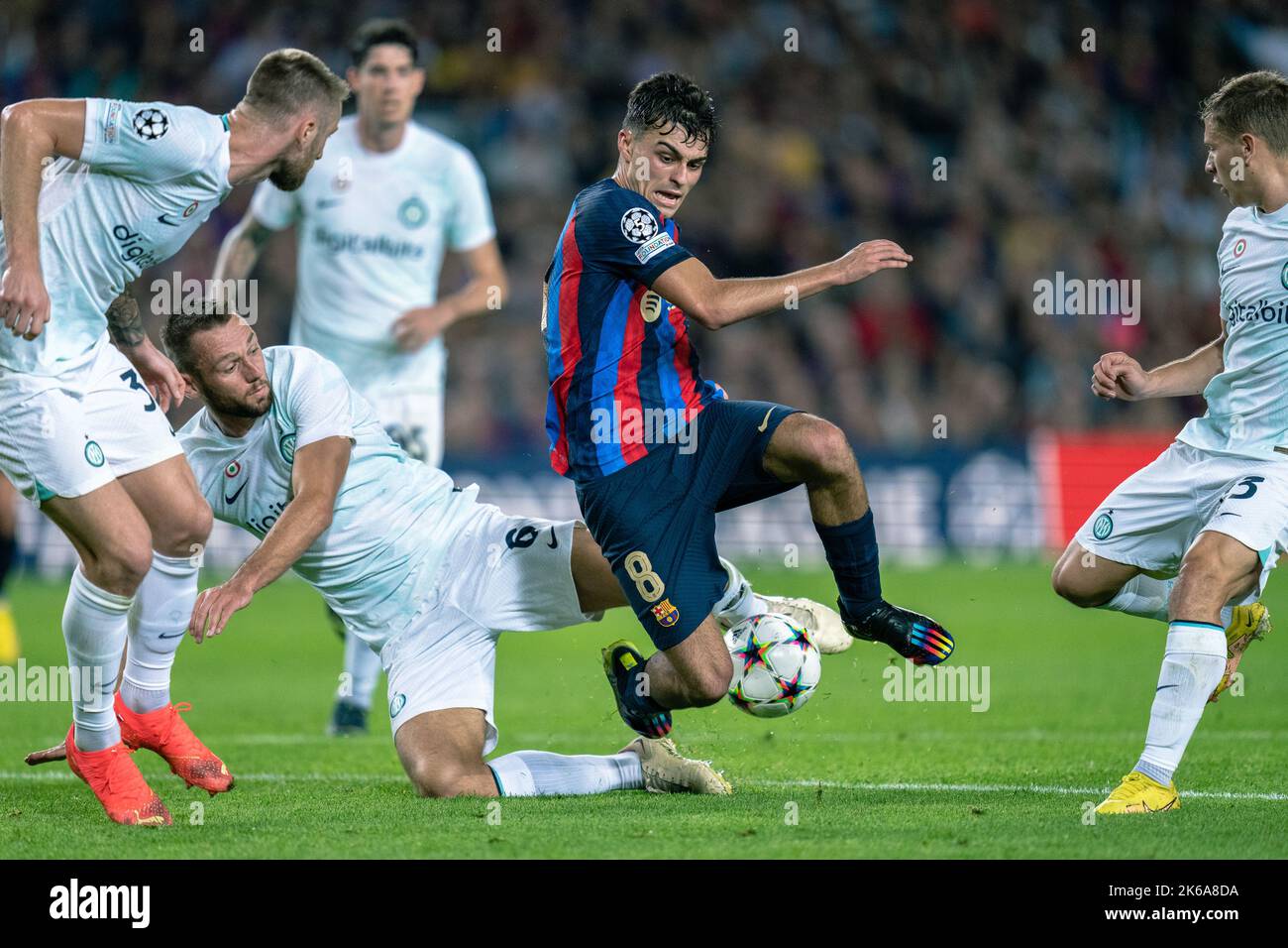 Barcelona, Spain. 12th Oct, 2022. Barcelona's Pedri (2nd R) vies with Inter Milan's Stefan de ...