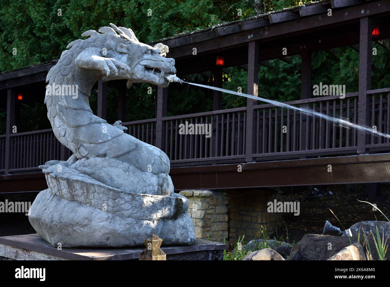 Dragon sculpture water feature Stock Photo - Alamy
