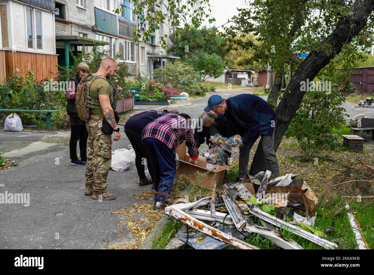 Lyman, Ukraine. 8th Oct, 2022. Residents in a badly shelled ...