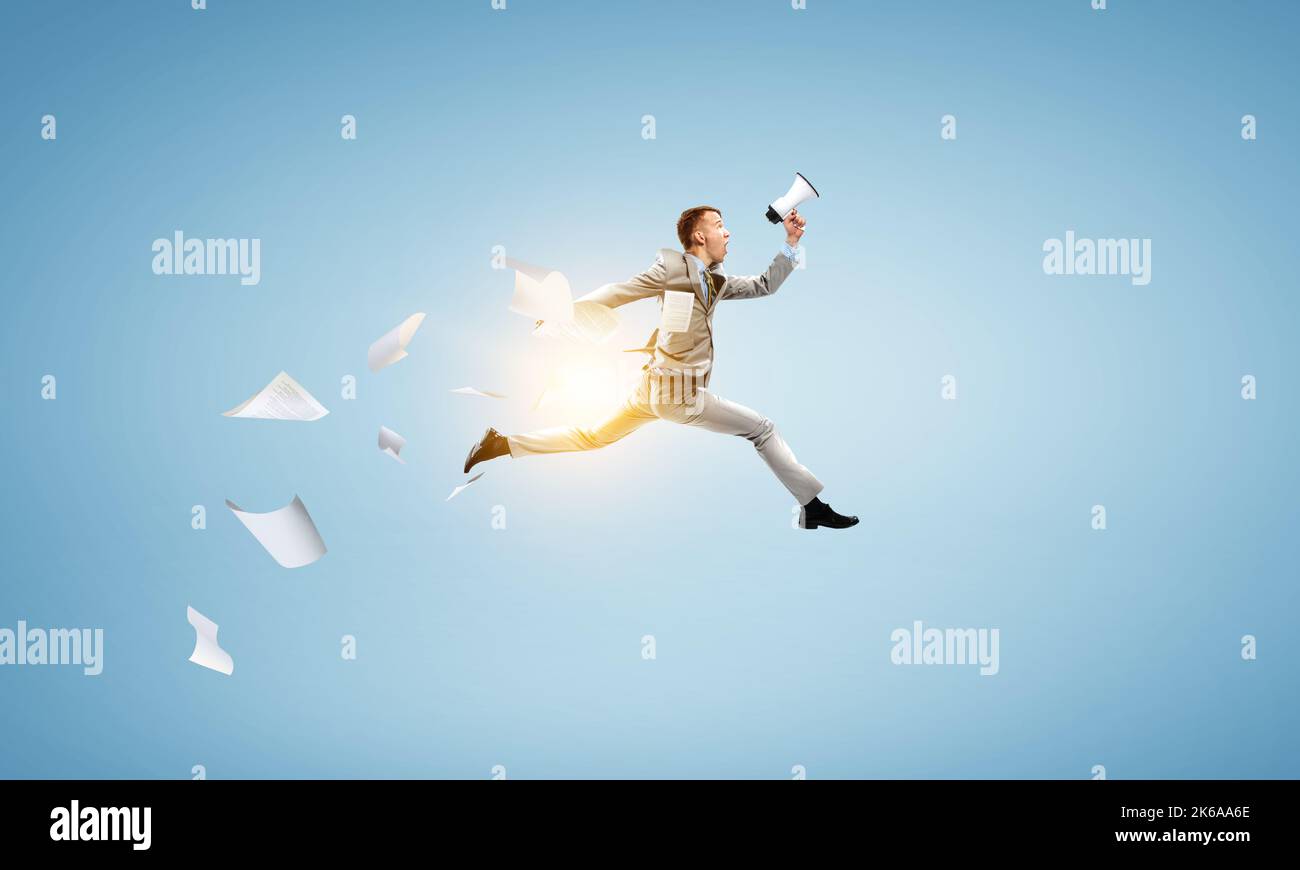 Portrait of energetic businessman jumping in open air Stock Photo - Alamy