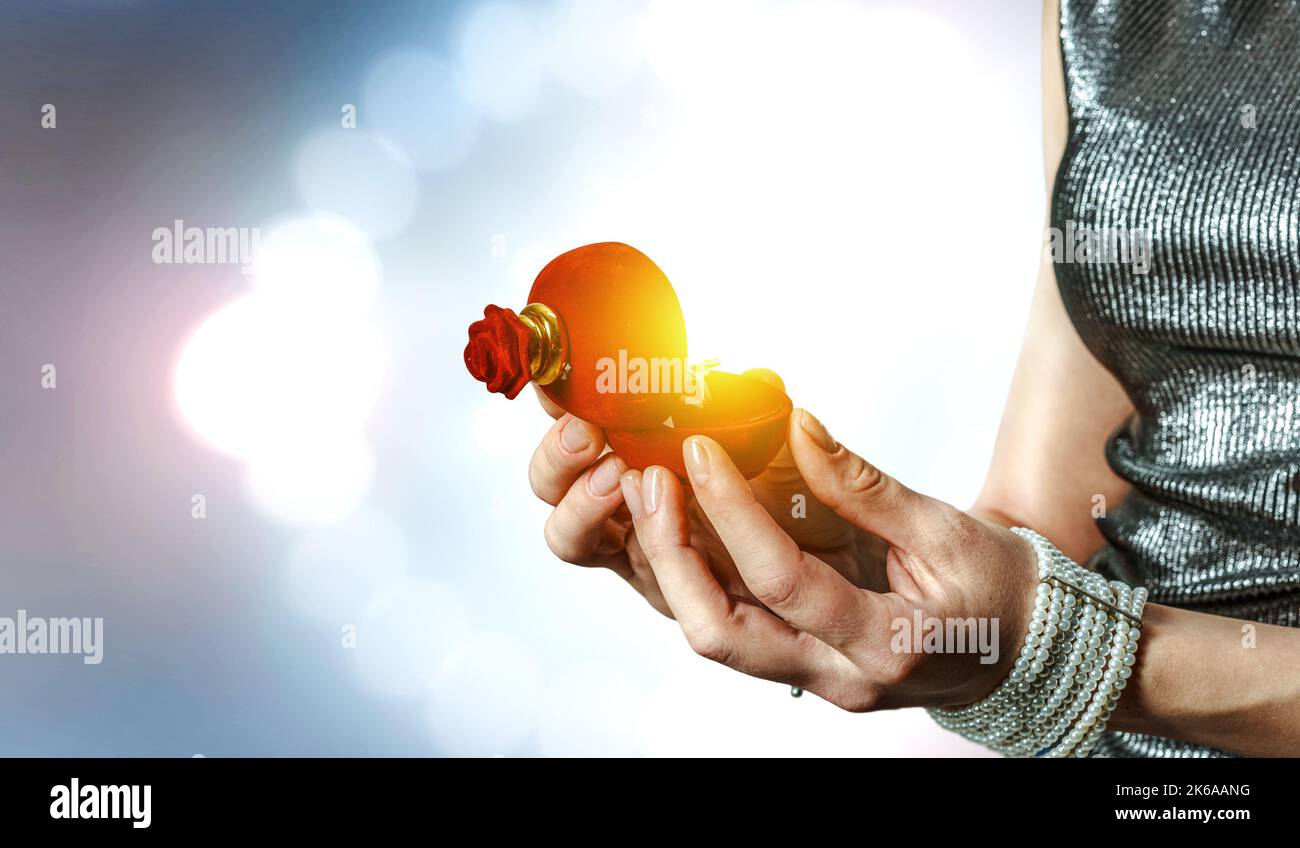 Closeup hands giving surprise gift box Stock Photo - Alamy