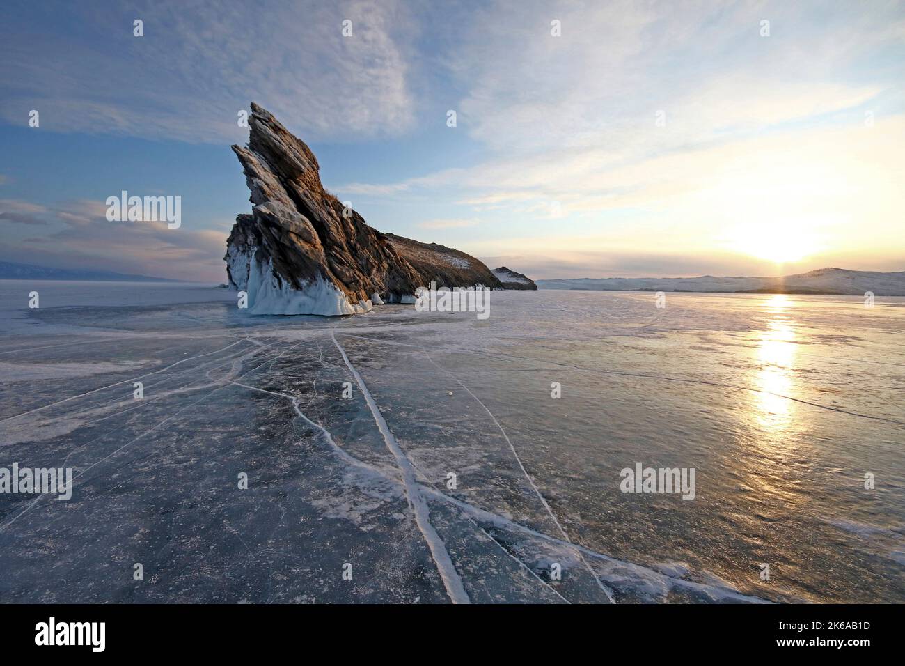 Rock formation protruding from the frozen lake, Lake Baikal, Russia ...