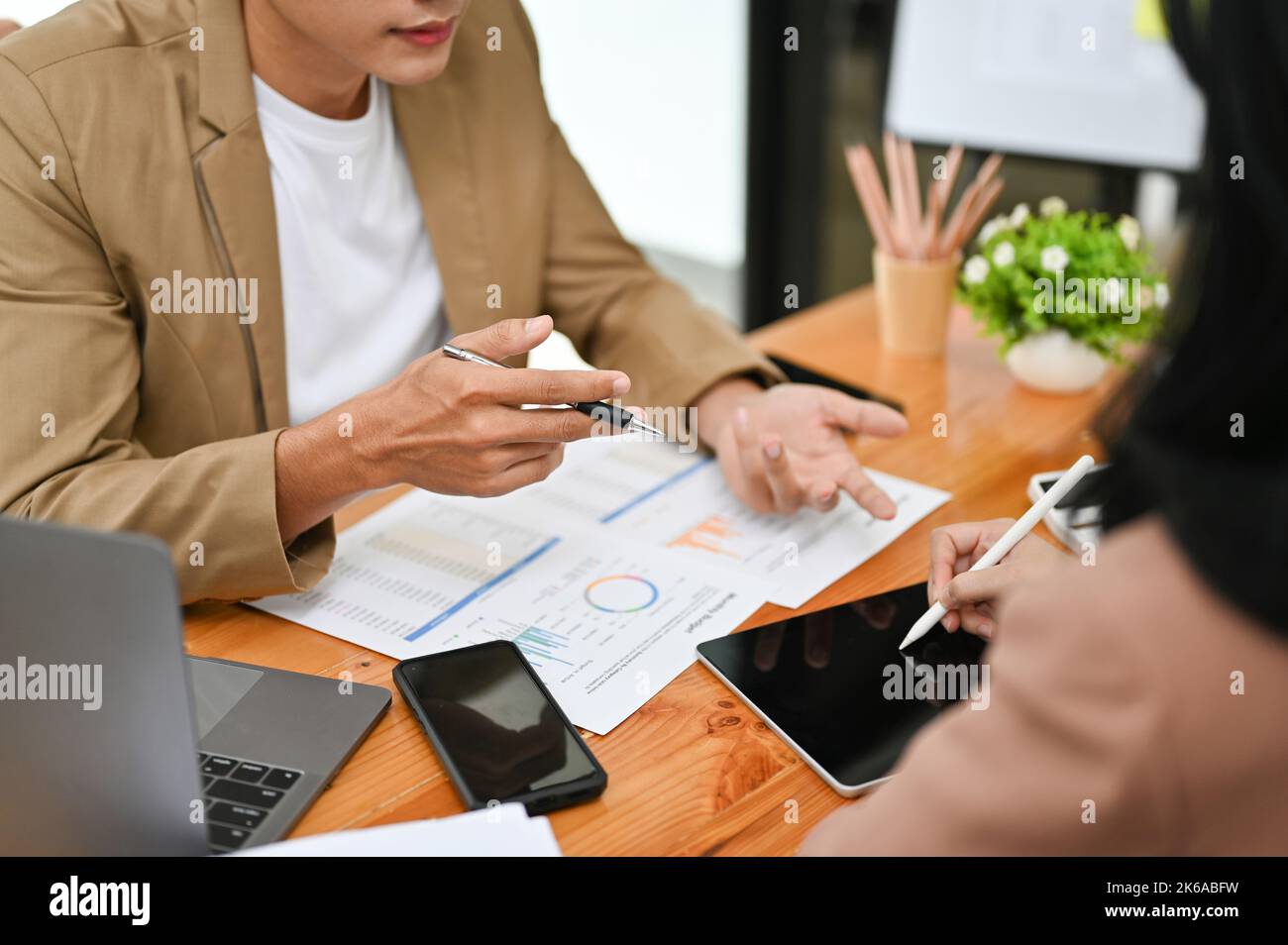 Professional millennial Asian male financial analyst or accountant ...