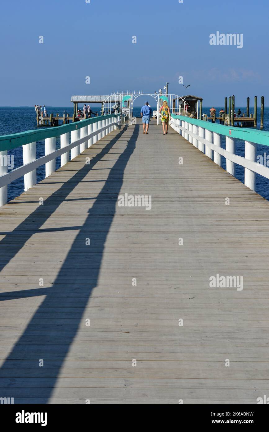 A couple enjoy the Bokeelia Fishing Pier located on the northern tip of ...