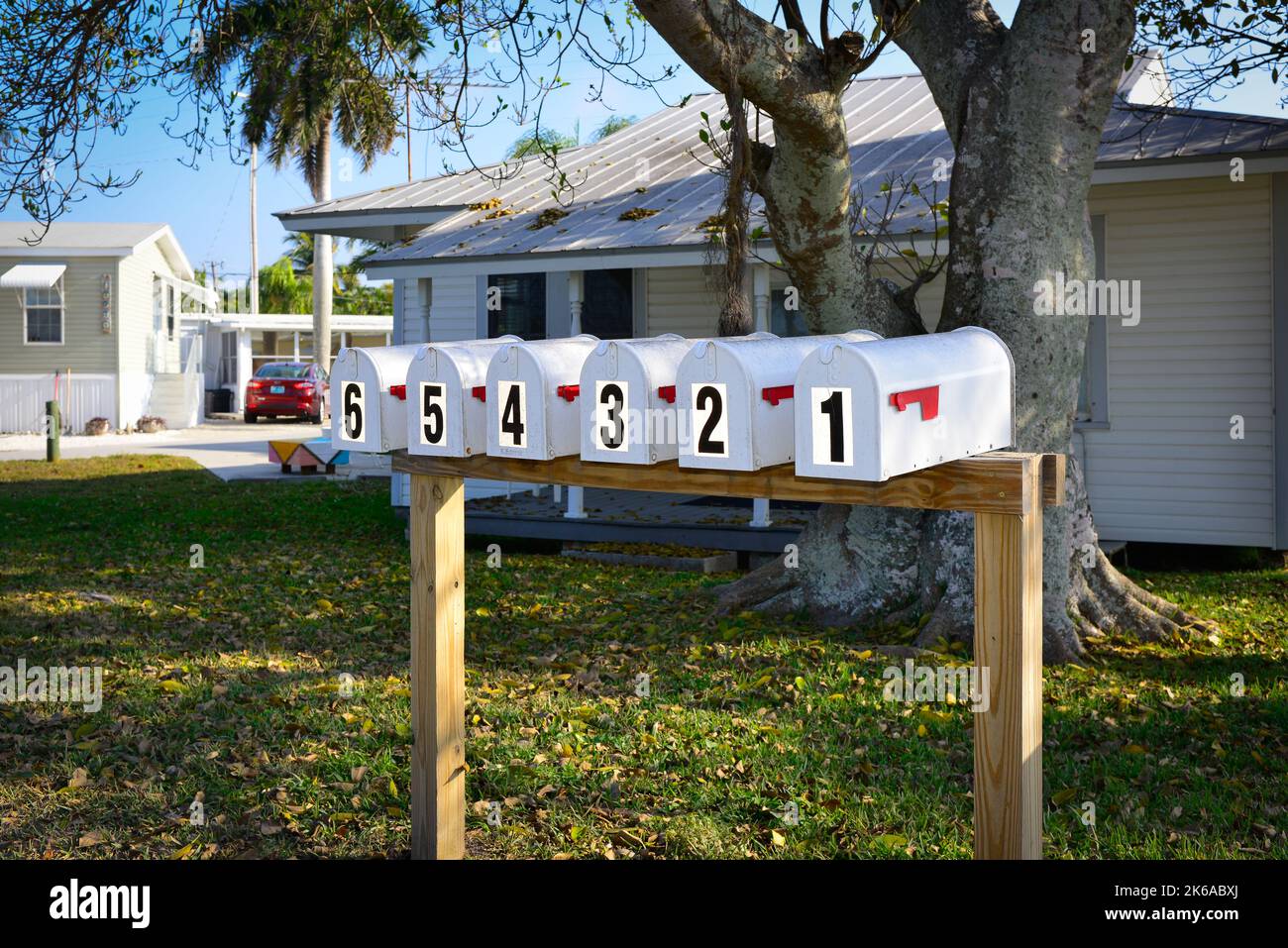 A simplistic yet graphic presentation of six identical mailboxes in a ...