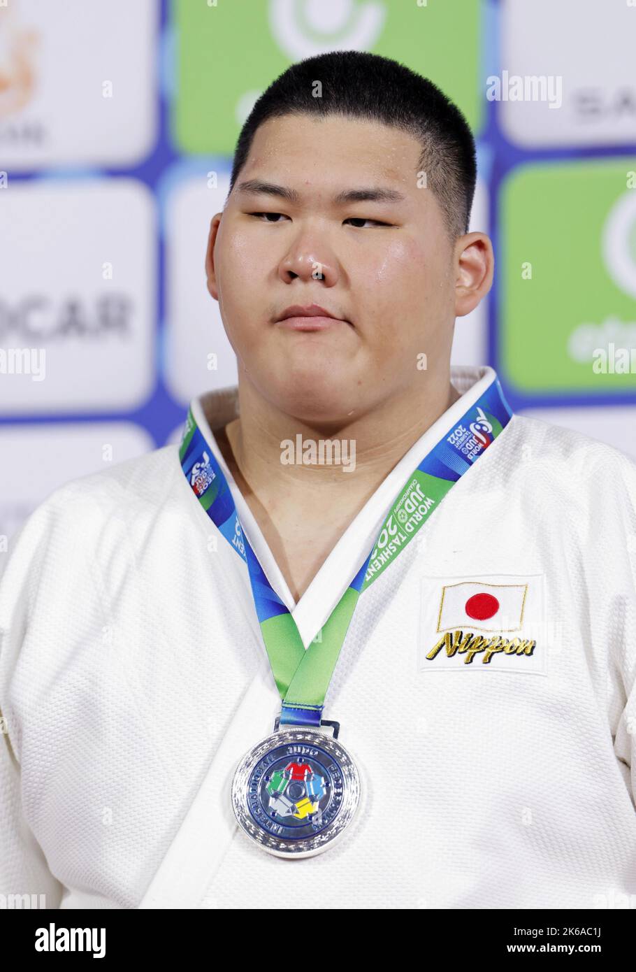 Japan's Tatsuru Saito is pictured with his silver medal in the men's ...