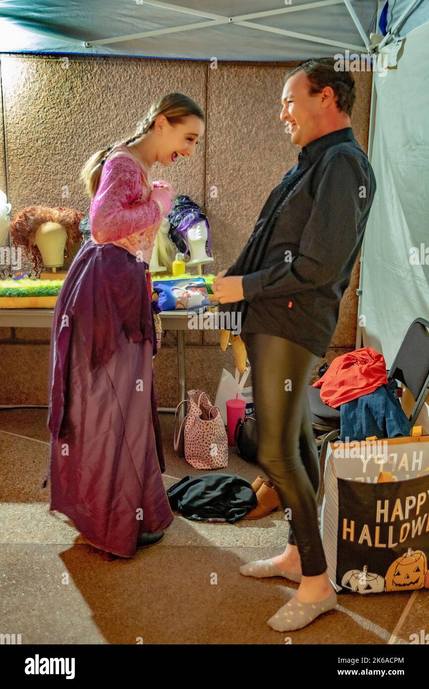 An actor and actress converse as they don costumes in their dressing ...