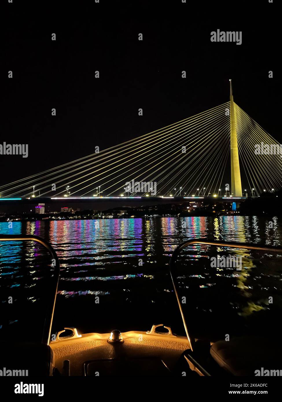 The Rama VIII Bridge across the Chao Phraya River in Bangkok at night ...