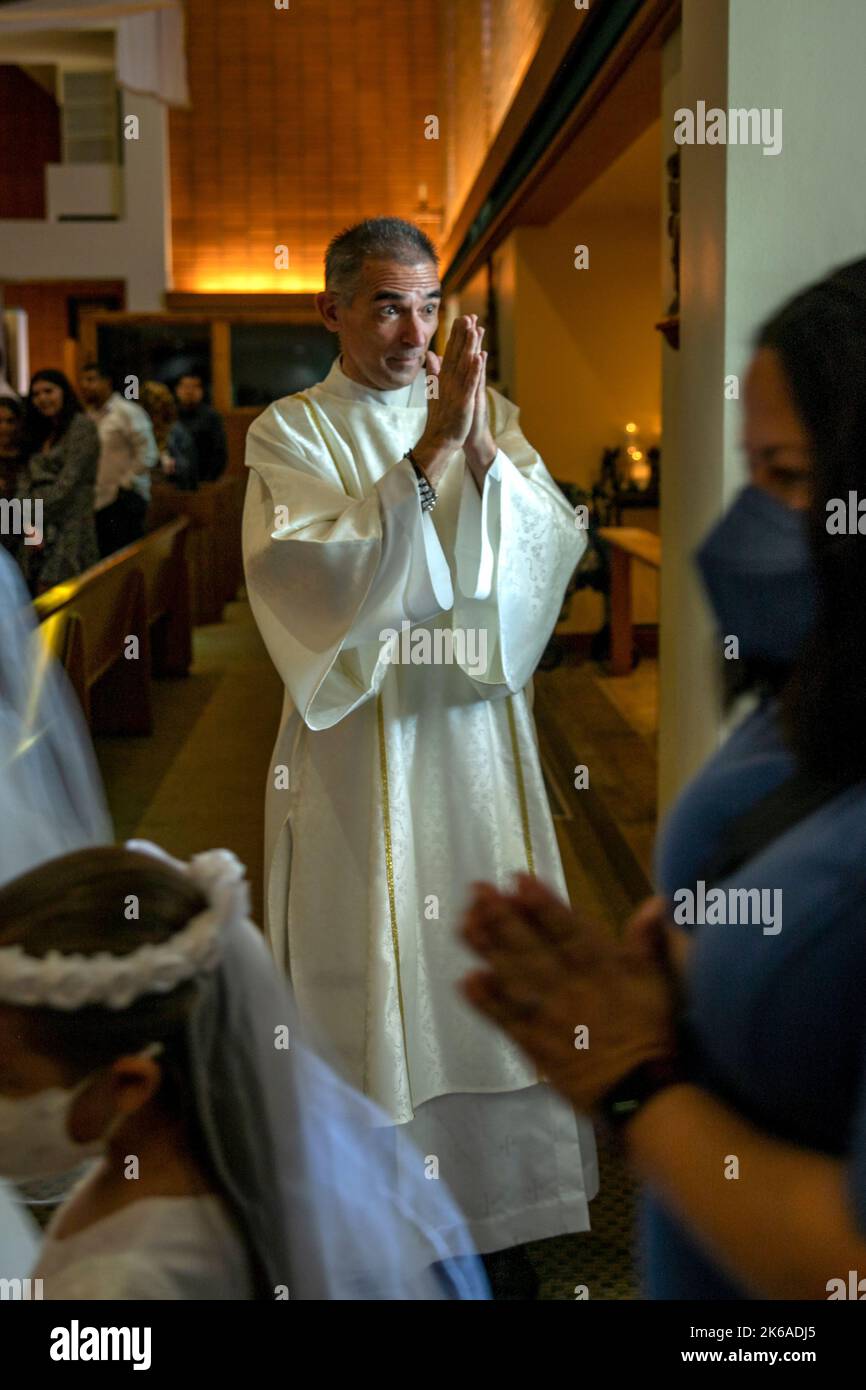 At the door of a Southern California Catholic church, the robed ...