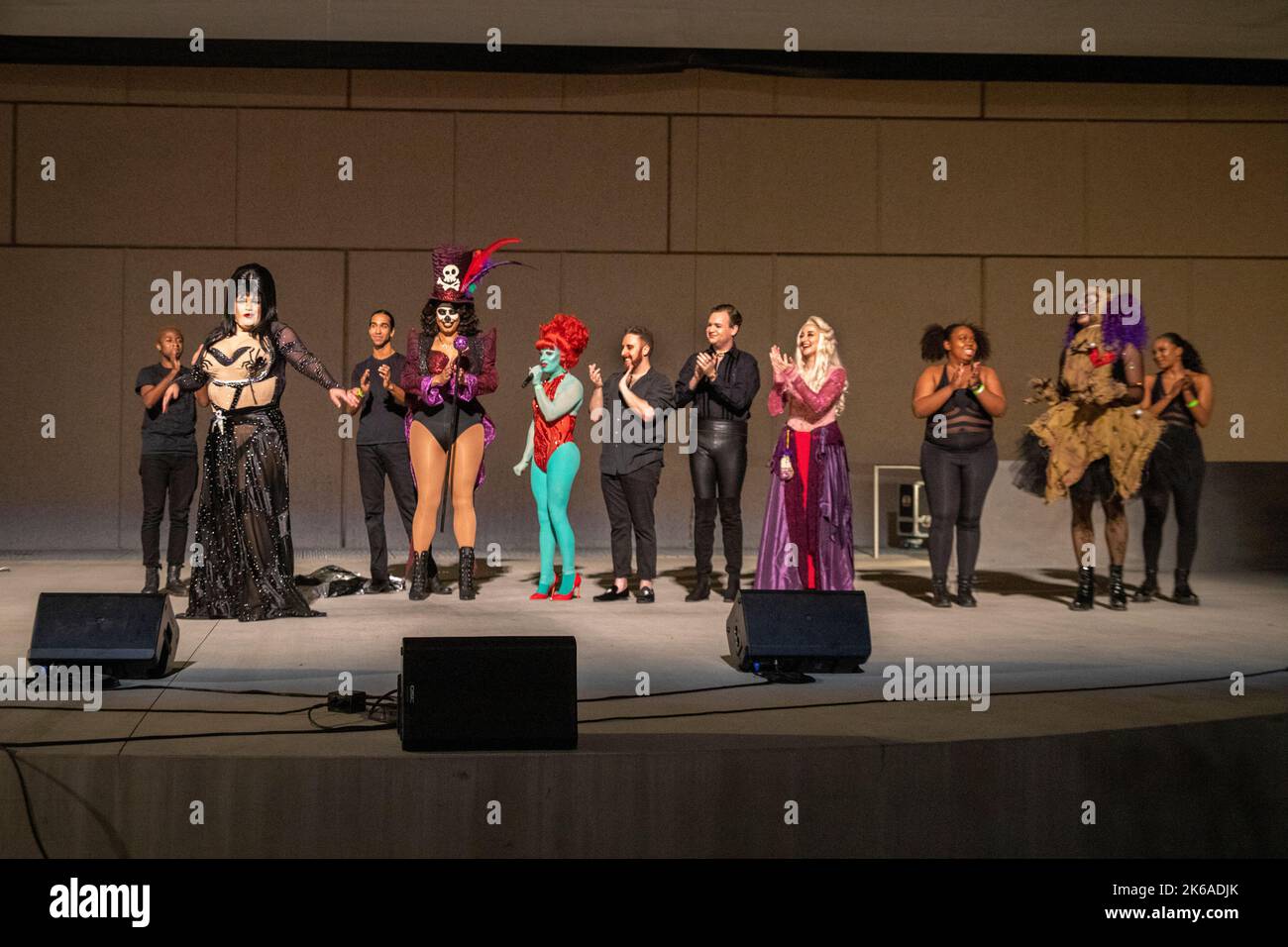Transvestite performers in a drag queen show entertain an audience in ...