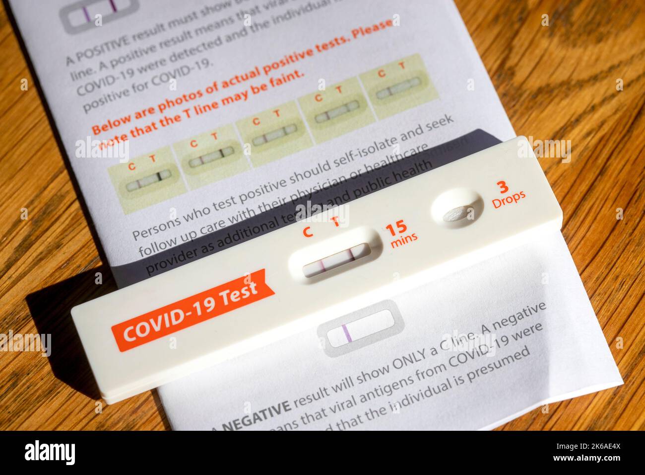 Two lines on a COVI9-19 rapid test indicate a positive result and the ...
