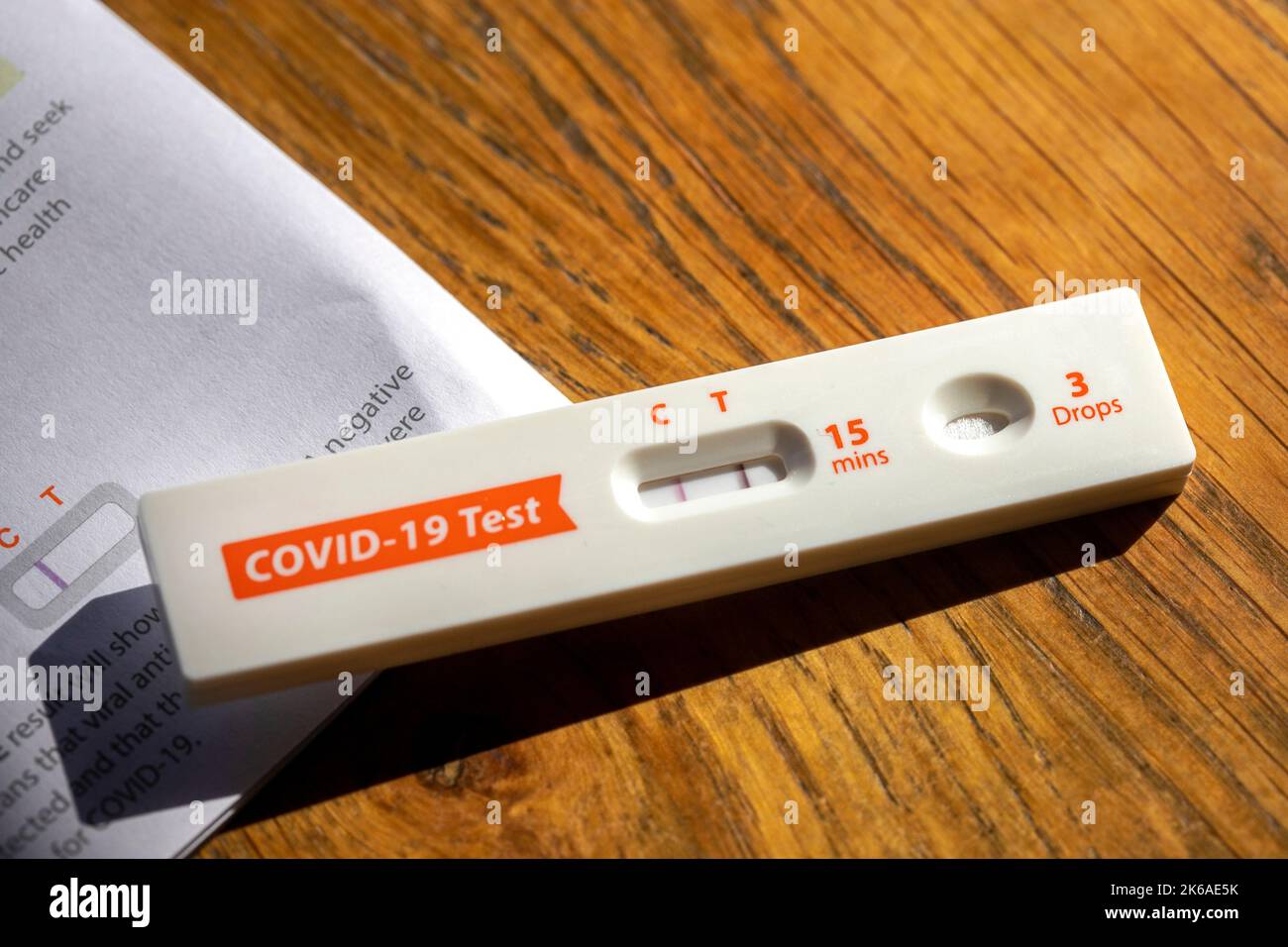 Two lines on a COVI9-19 rapid test indicate a positive result and the ...