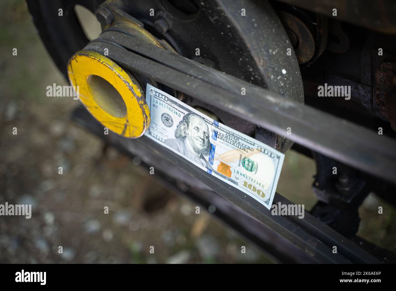 Hundred dollar bill close-up on an industrial background. Money on a ...