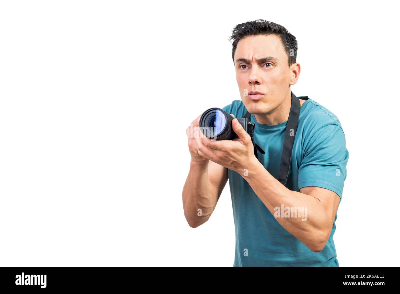 Focused man taking pictures on photo camera Stock Photo - Alamy