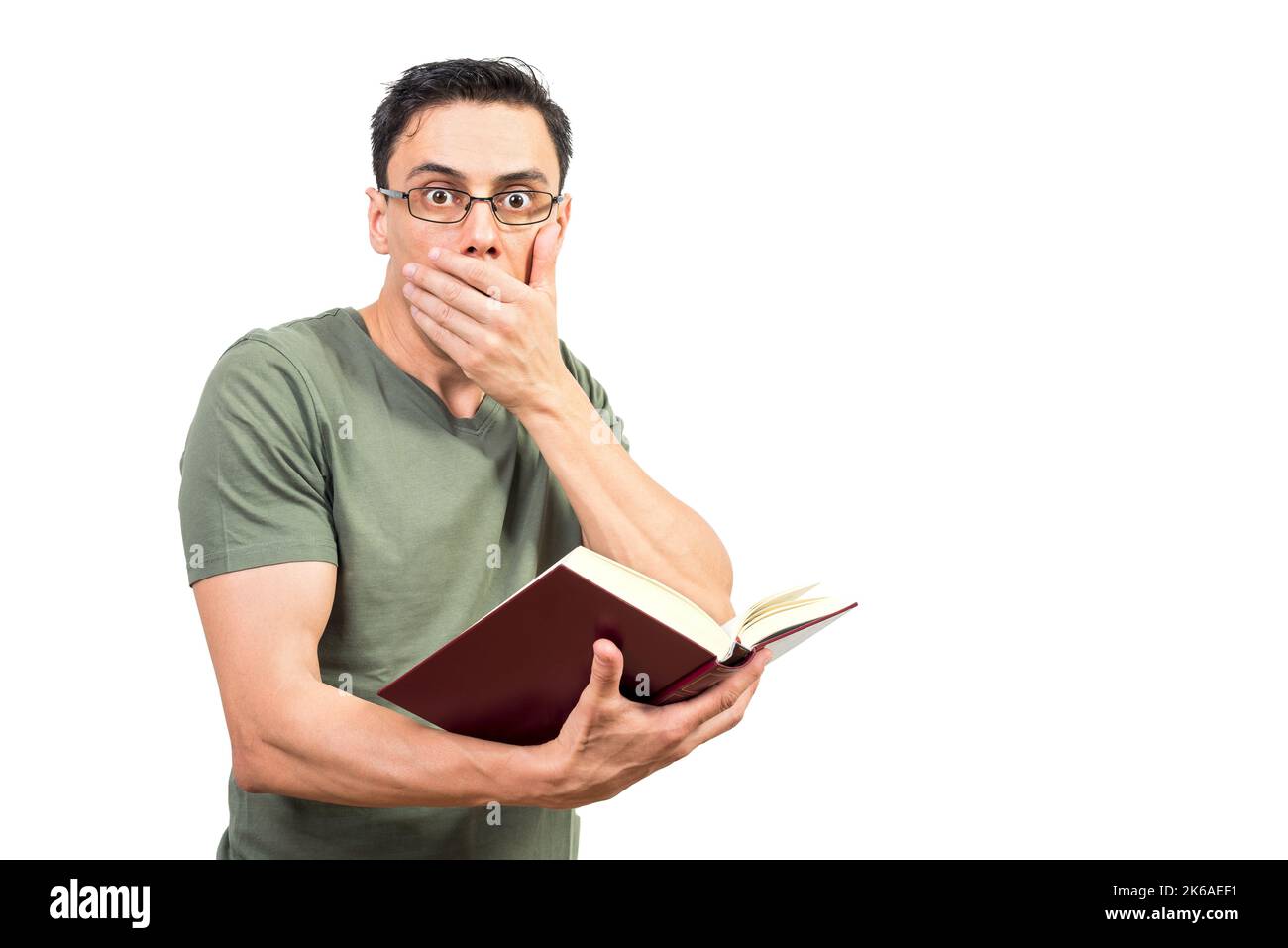 Smart man in glasses reading shocking book Stock Photo - Alamy