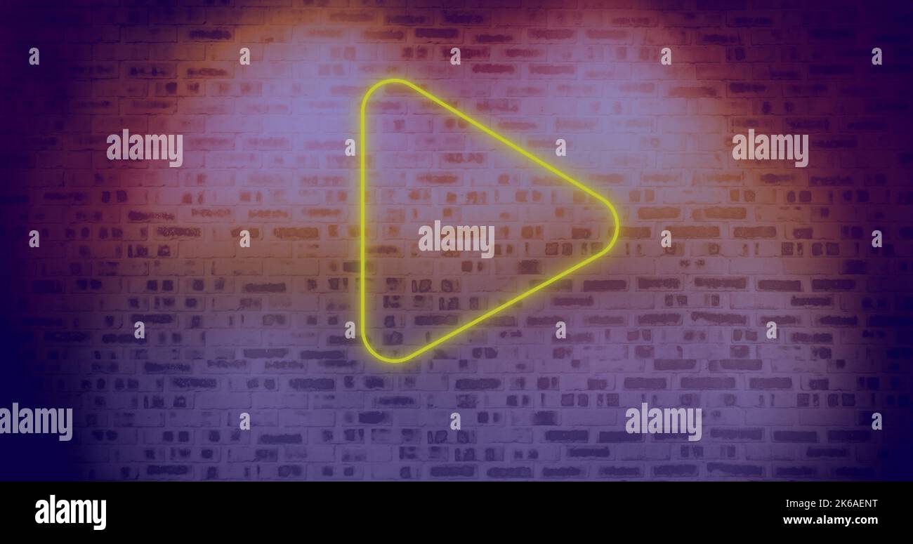 Image of neon play symbol over brick wall. Social media, communication ...