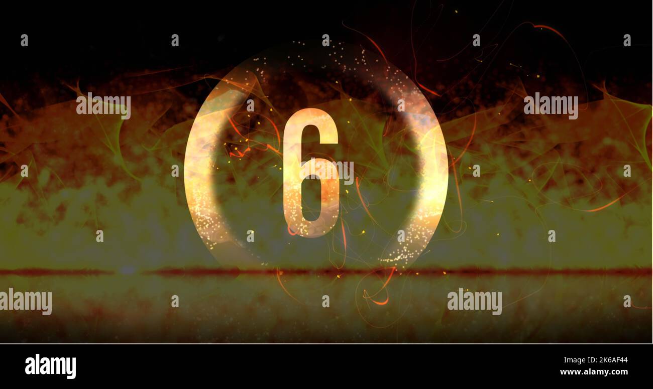 Image of ring and glowing number six in dramatic countdown over flaming ...