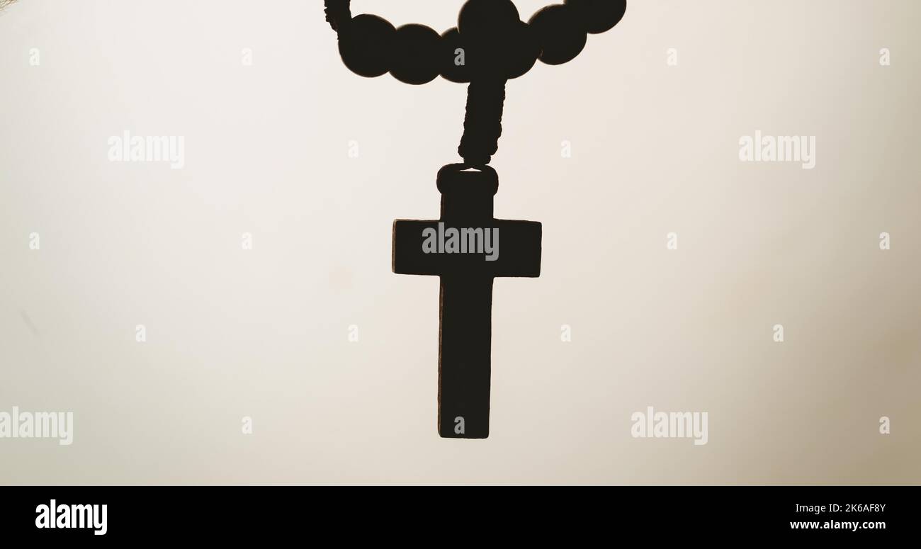 Image of rosary with cross on beige background. Christianity, faith ...