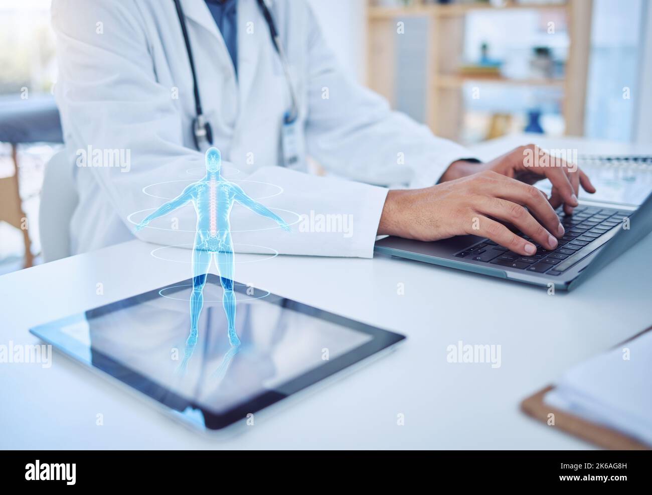 Doctor typing, laptop and tablet hologram, futuristic body graphic or ...