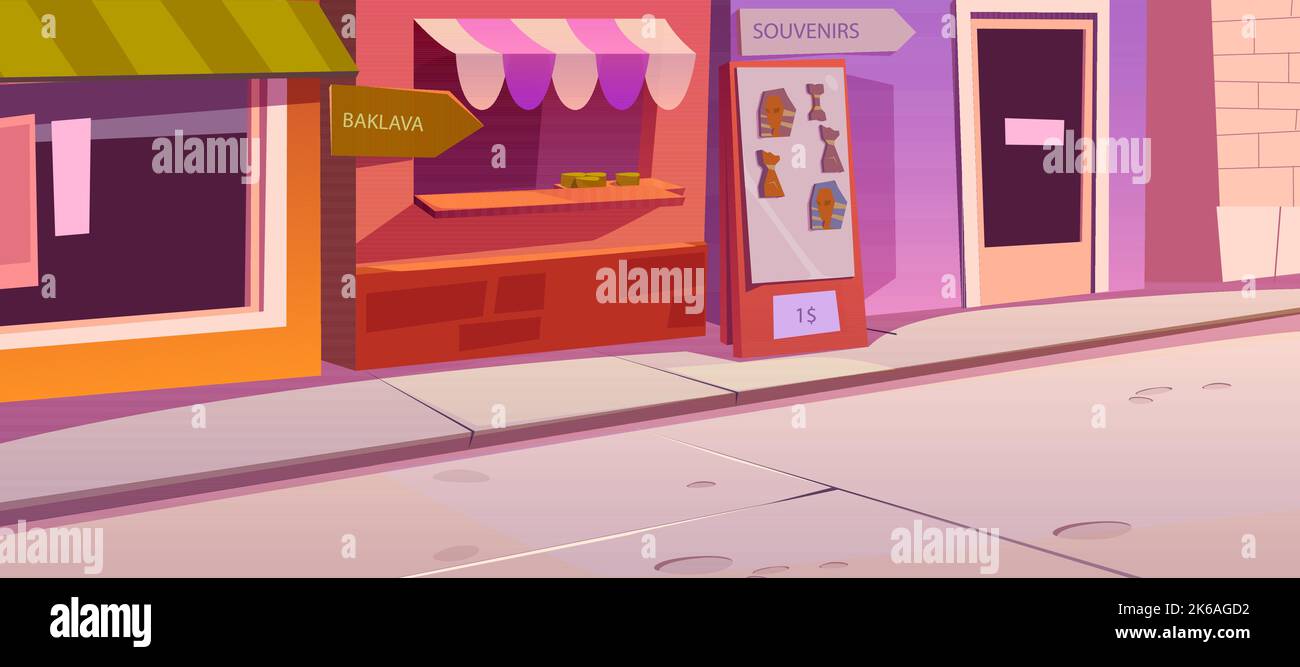 City street with old buildings and market stalls along asphalted road ...