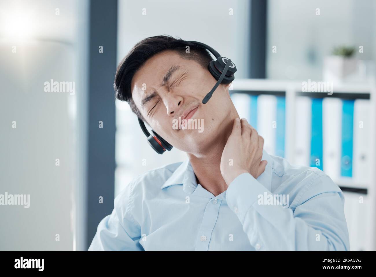 Man, call center and pain in neck from stress, burnout and tired in ...
