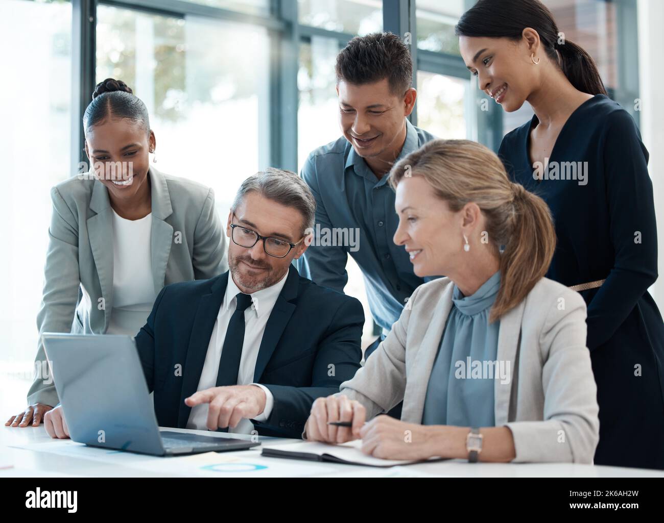 Business people, laptop and team collaboration for planning, strategy ...