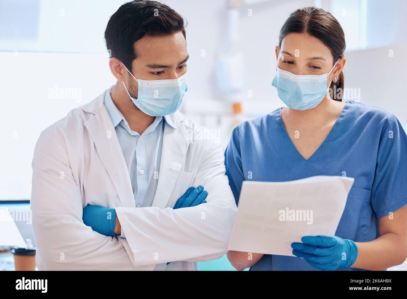 Getting their data up to scratch. a young dentist reading through ...
