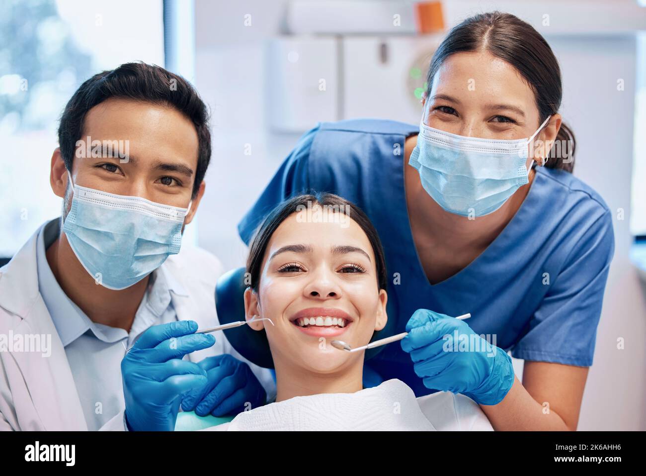 Getting into the nitty gritty. a young woman getting her teeth cleaned ...