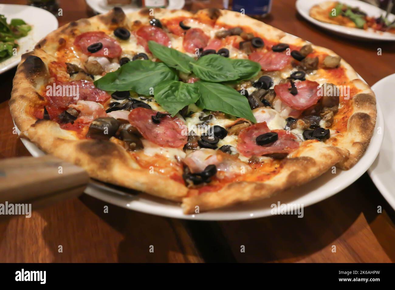 pizza or salami , olive and cheese pizza with vegetable topping Stock ...