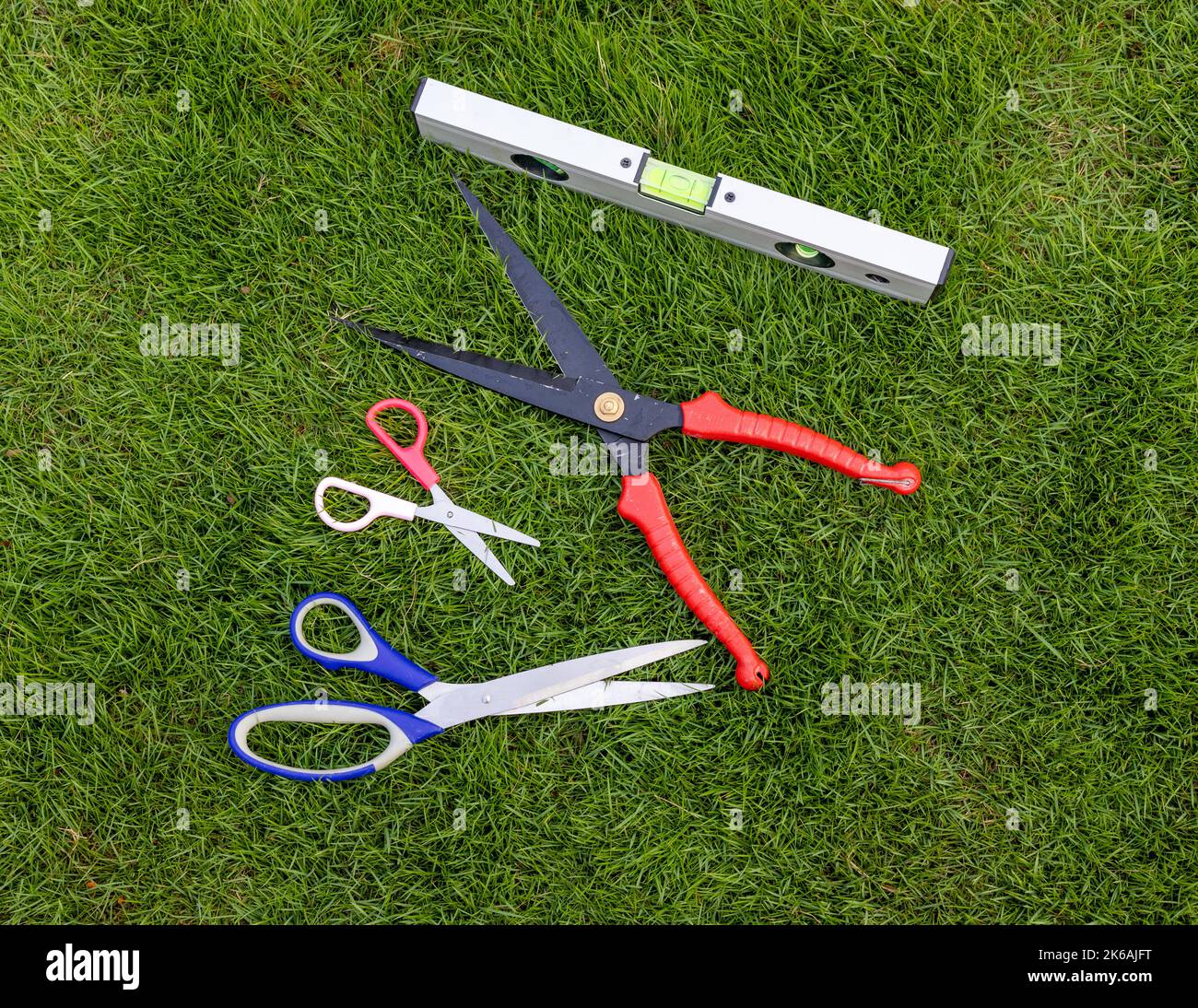 Cuttings tools laying in the lawn Stock Photo - Alamy