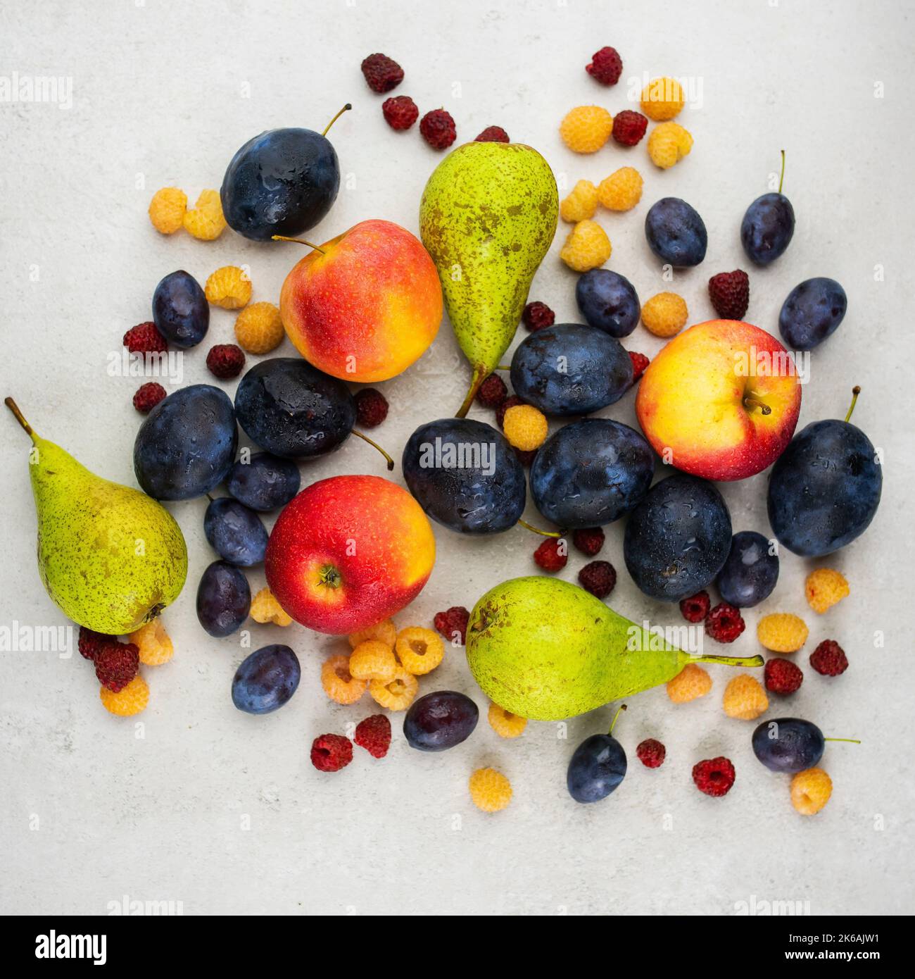 A closeup of different types of fruits in white background Stock Photo ...