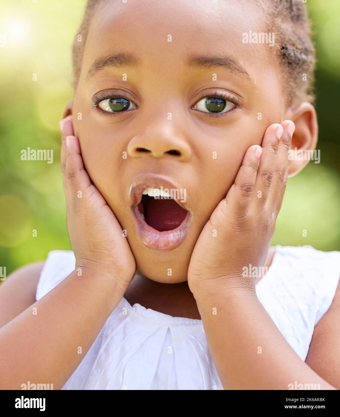 What a surprise. a little girl looking surprised in nature Stock Photo ...