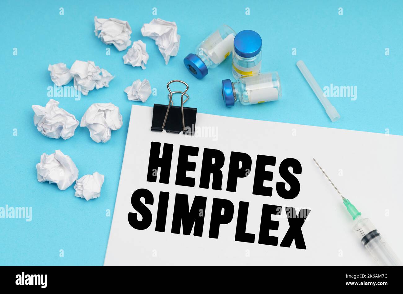 Medicine concept. On a blue background, a syringe, medicine, white ...