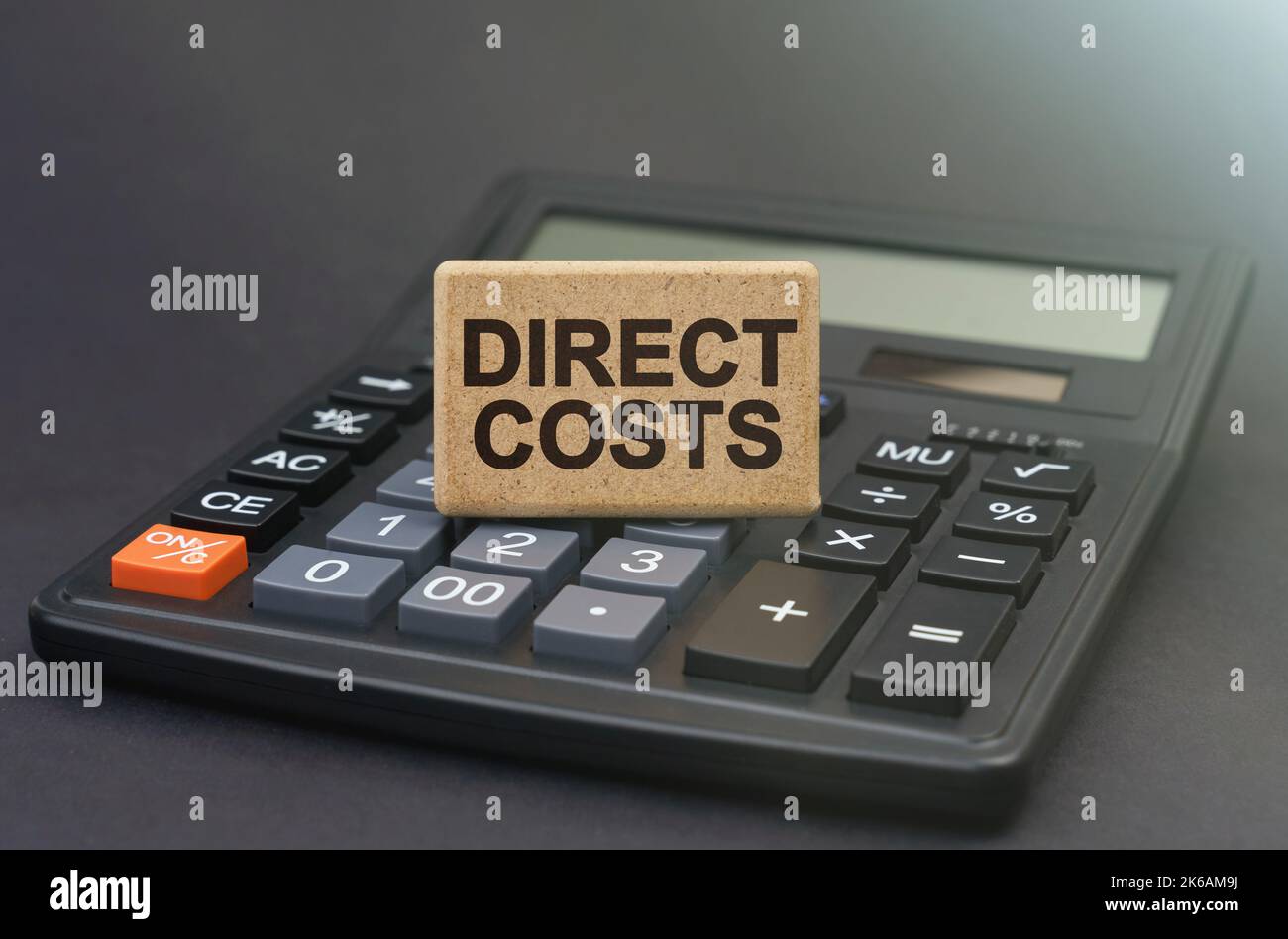 Business concept. There is a sign on the calculator that says - DIRECT ...