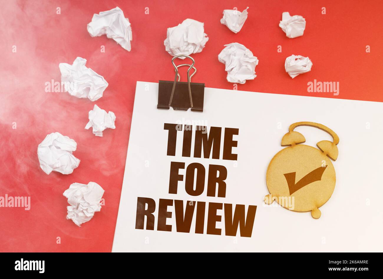 Business and finance concept. On a red background in smoke, crumpled ...