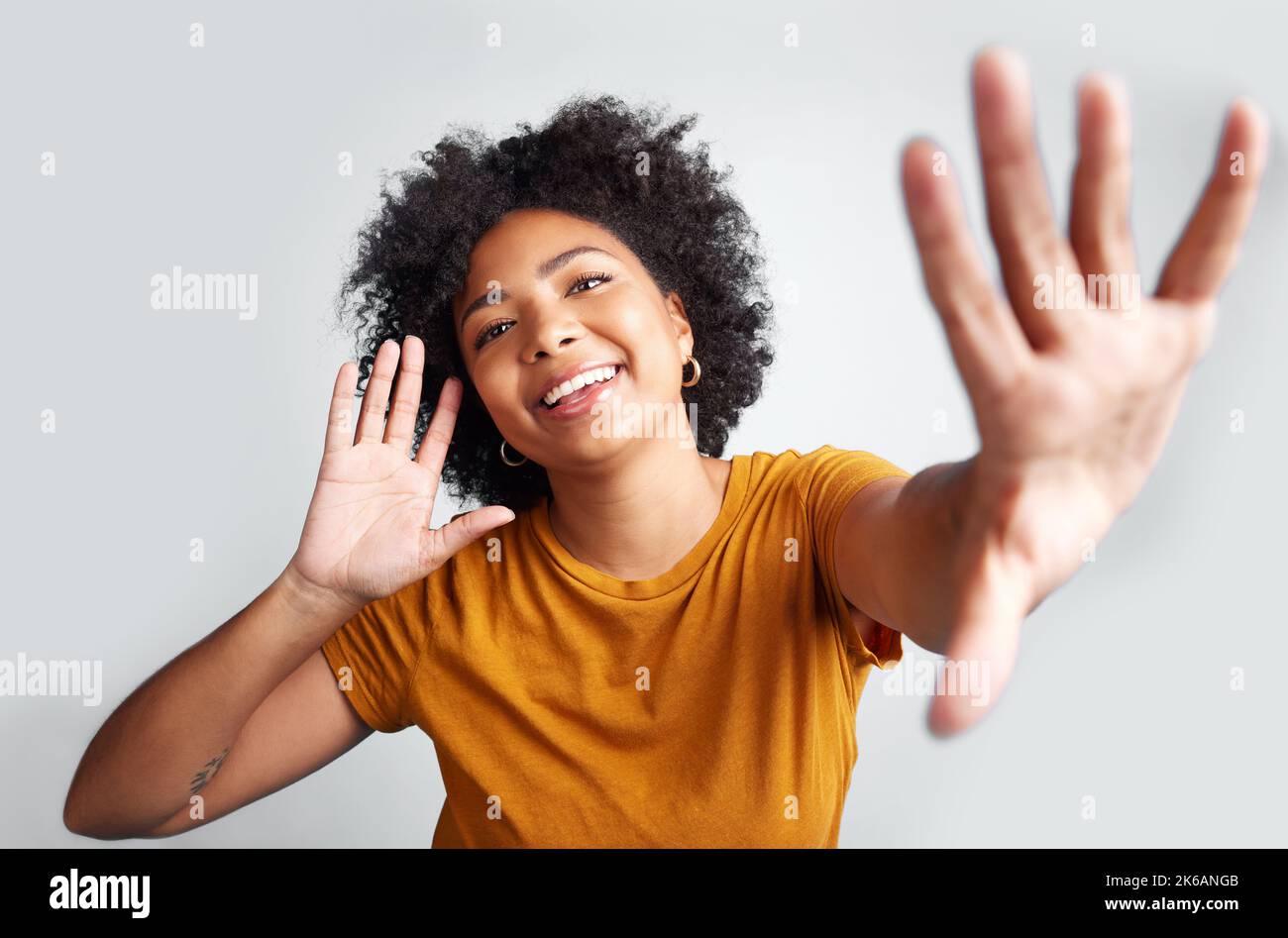 I want to live life this way. a young woman posing against a grey ...