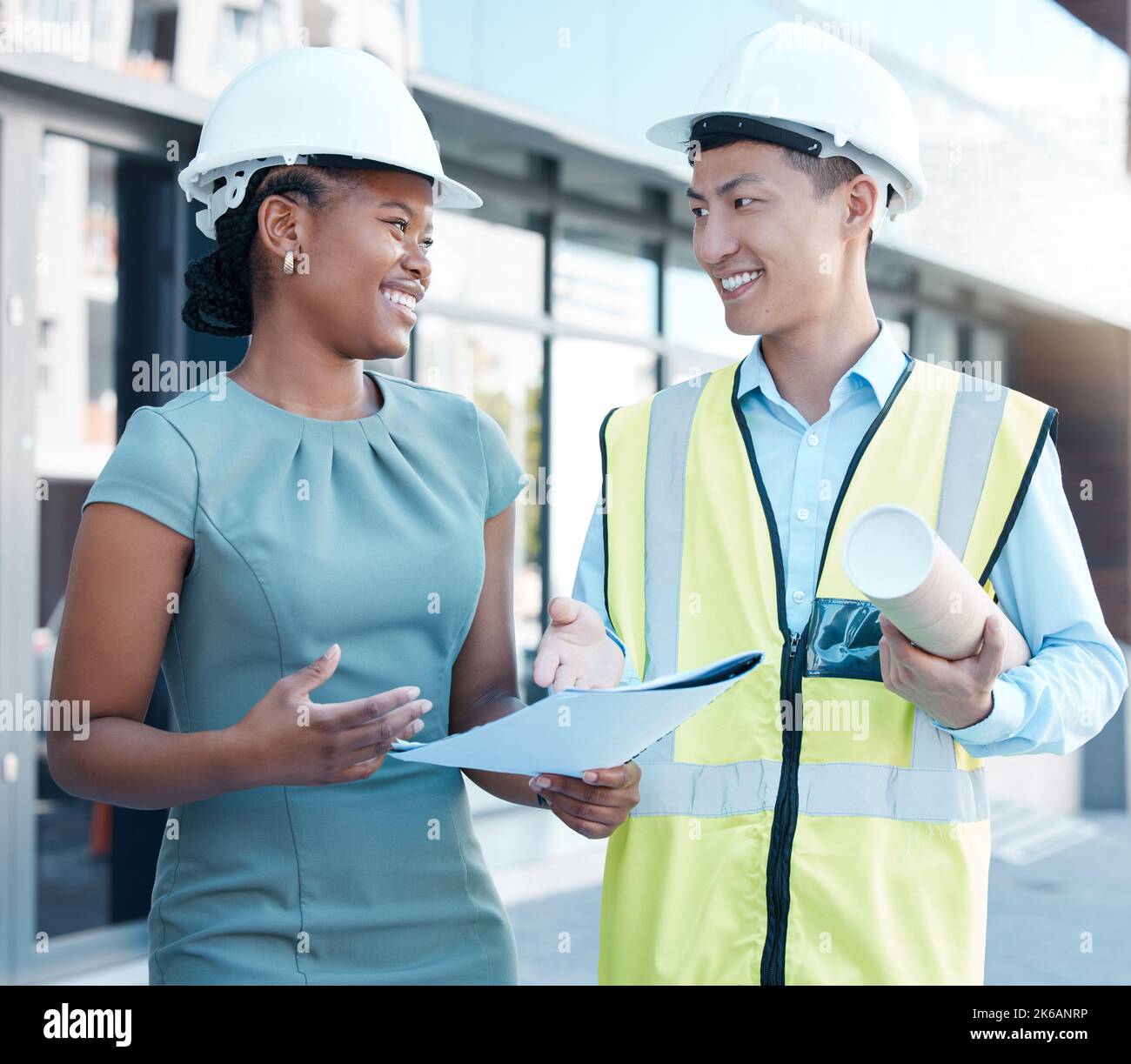 Diversity, architect man and business woman in collaboration conversation, building or planning ...