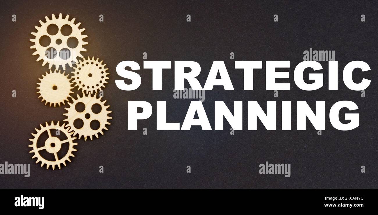 Business and industry concept. On a black background, gears and the ...