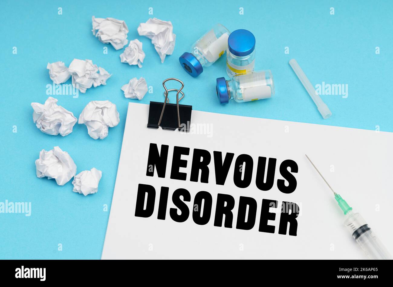 Medicine concept. On a blue background, a syringe, medicine, white ...