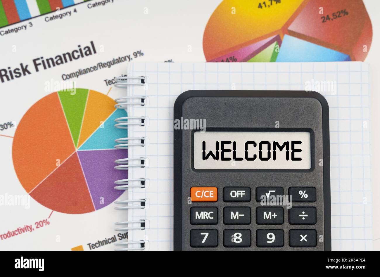 Business and economy concept. On the table are charts, a notebook and a ...